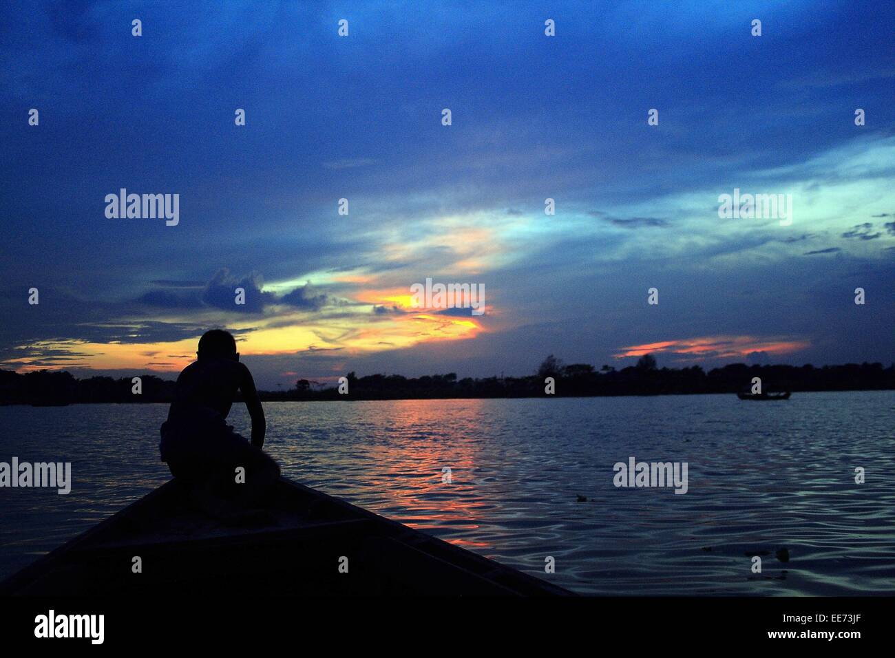 Bangladesh 10 January 2015. Sunset over Surma River in Sunamganj Stock ...
