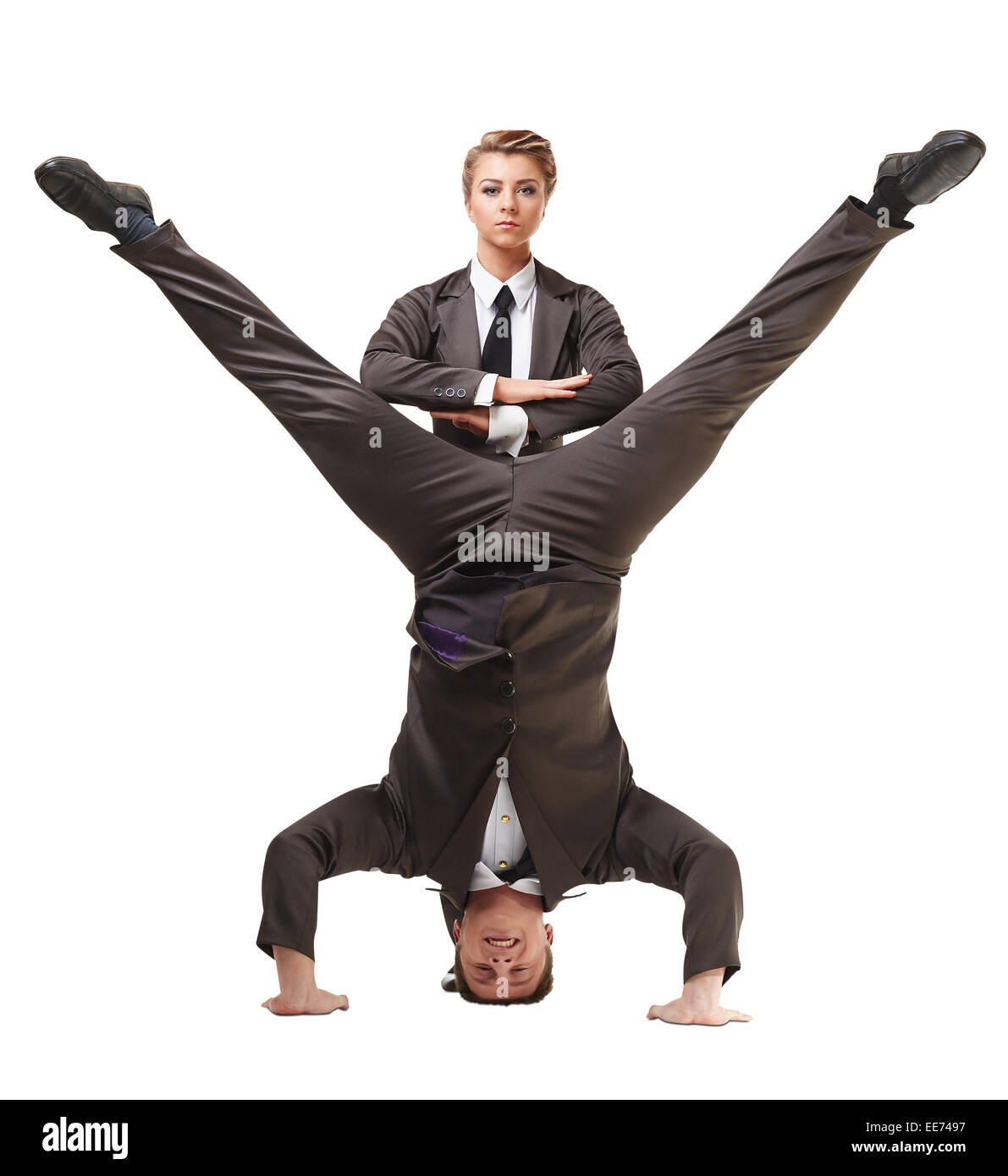 Two handsome acrobats posing in official suits Stock Photo - Alamy