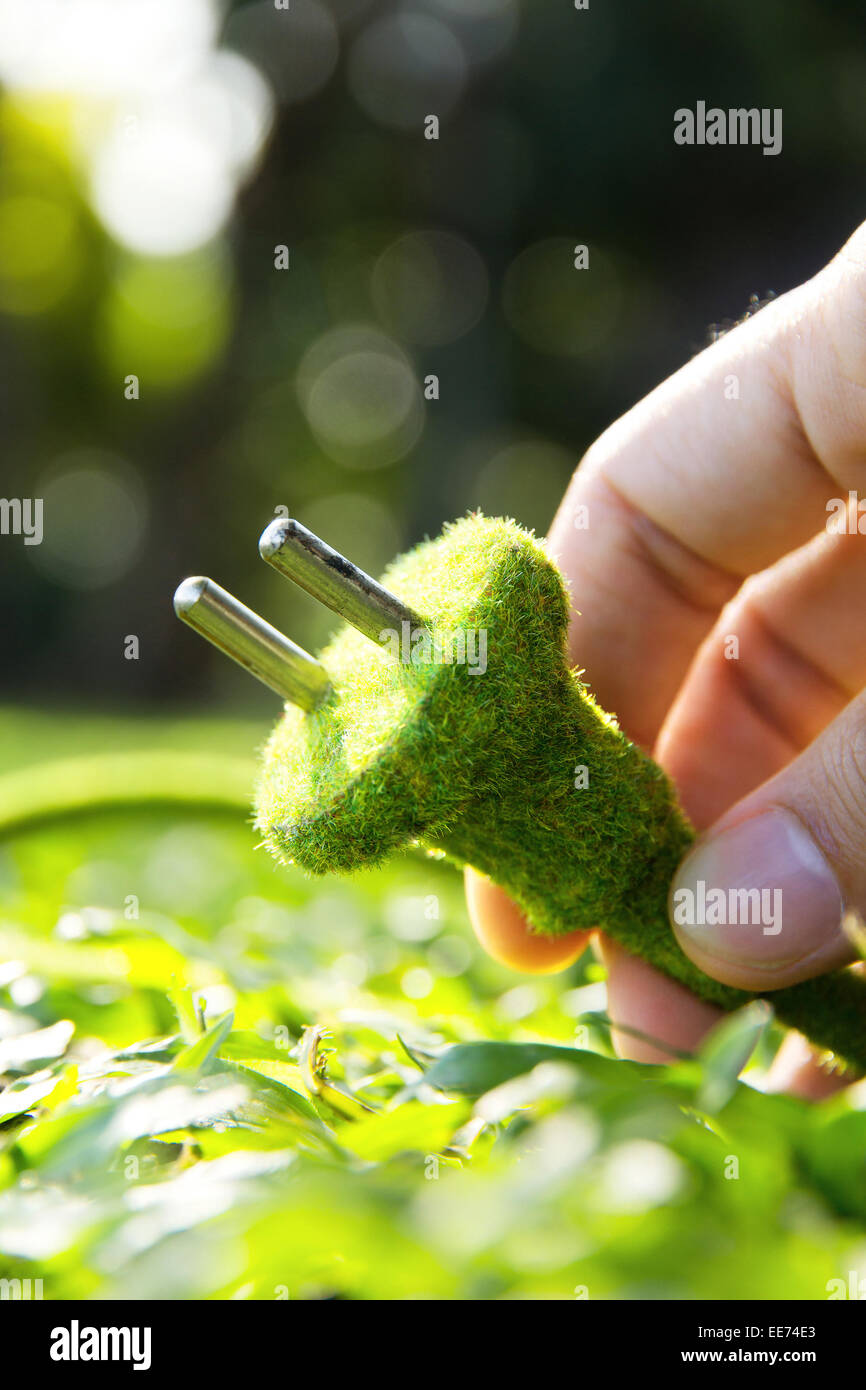 green electric plug concept Stock Photo - Alamy