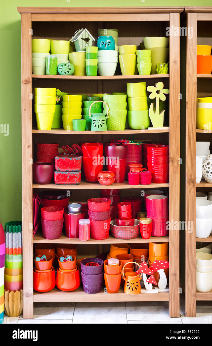 new colored planters in the florist shop Stock Photo - Alamy