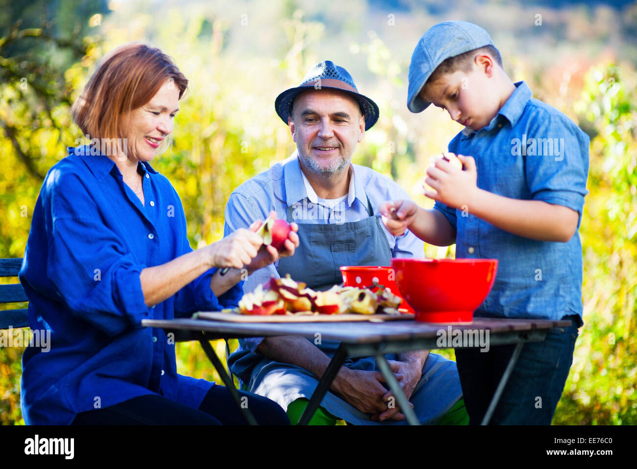 Multi-generation family peeling apples, Munich, Bavaria, Germany Stock ...