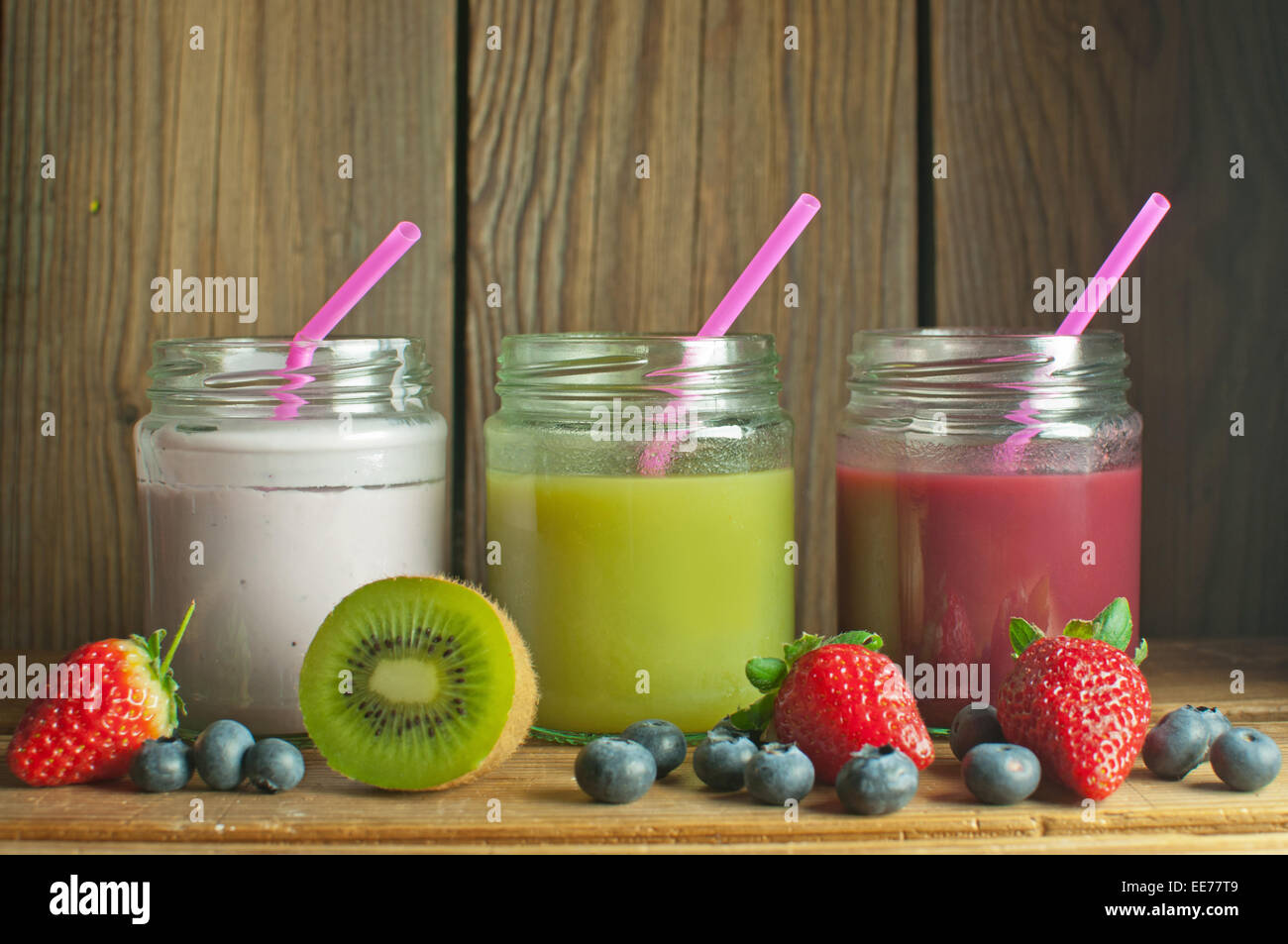 Three smoothies in jars Stock Photo - Alamy
