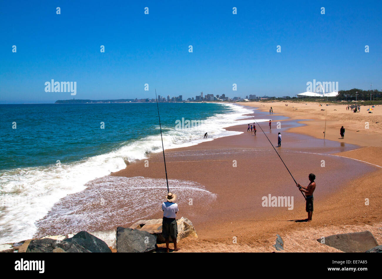 DURBAN, SOUTH AFRICA - DECEMBER 18, 2014: Many unknown fishermen fish ...