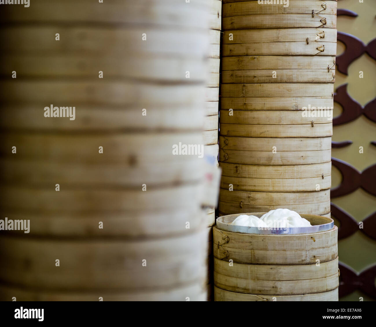 Bamboo rice steamers stacked with one open showing steamed buns Stock ...