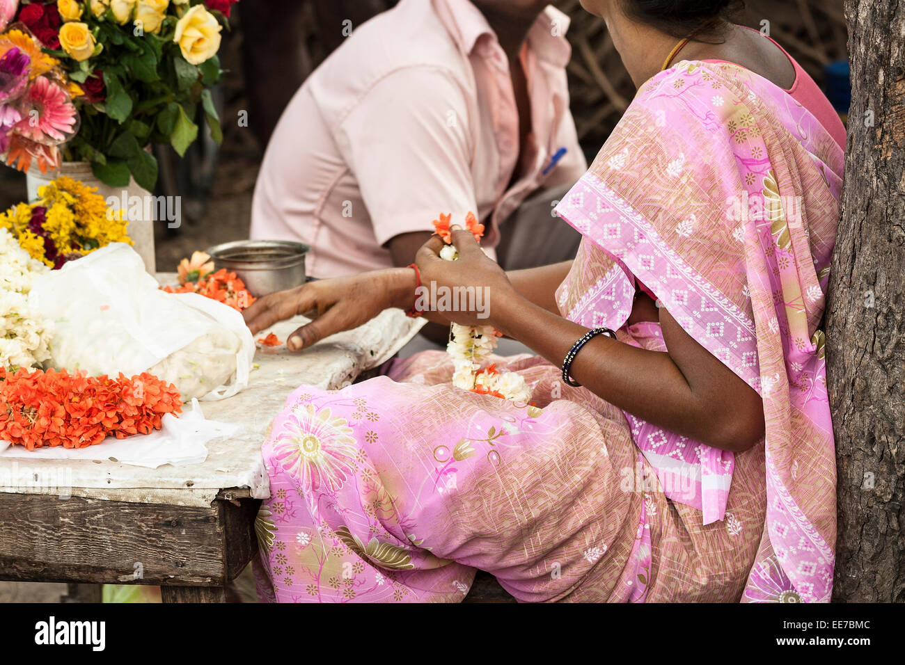 Indian woman selling flowers at village market, Karnataka, India Stock ...