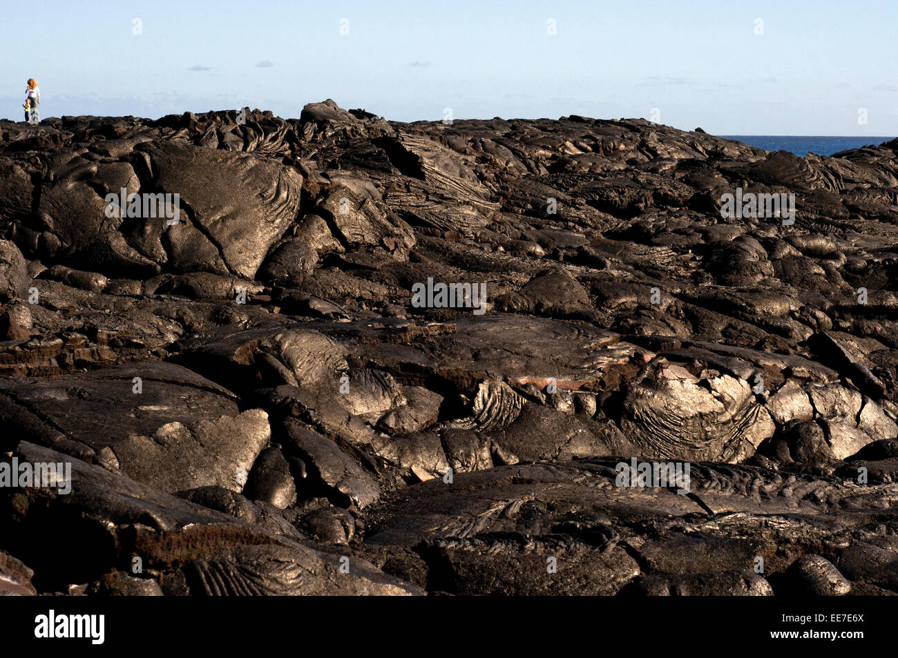 Black lava mountains near the coast and highway Chain of Crater Road ...