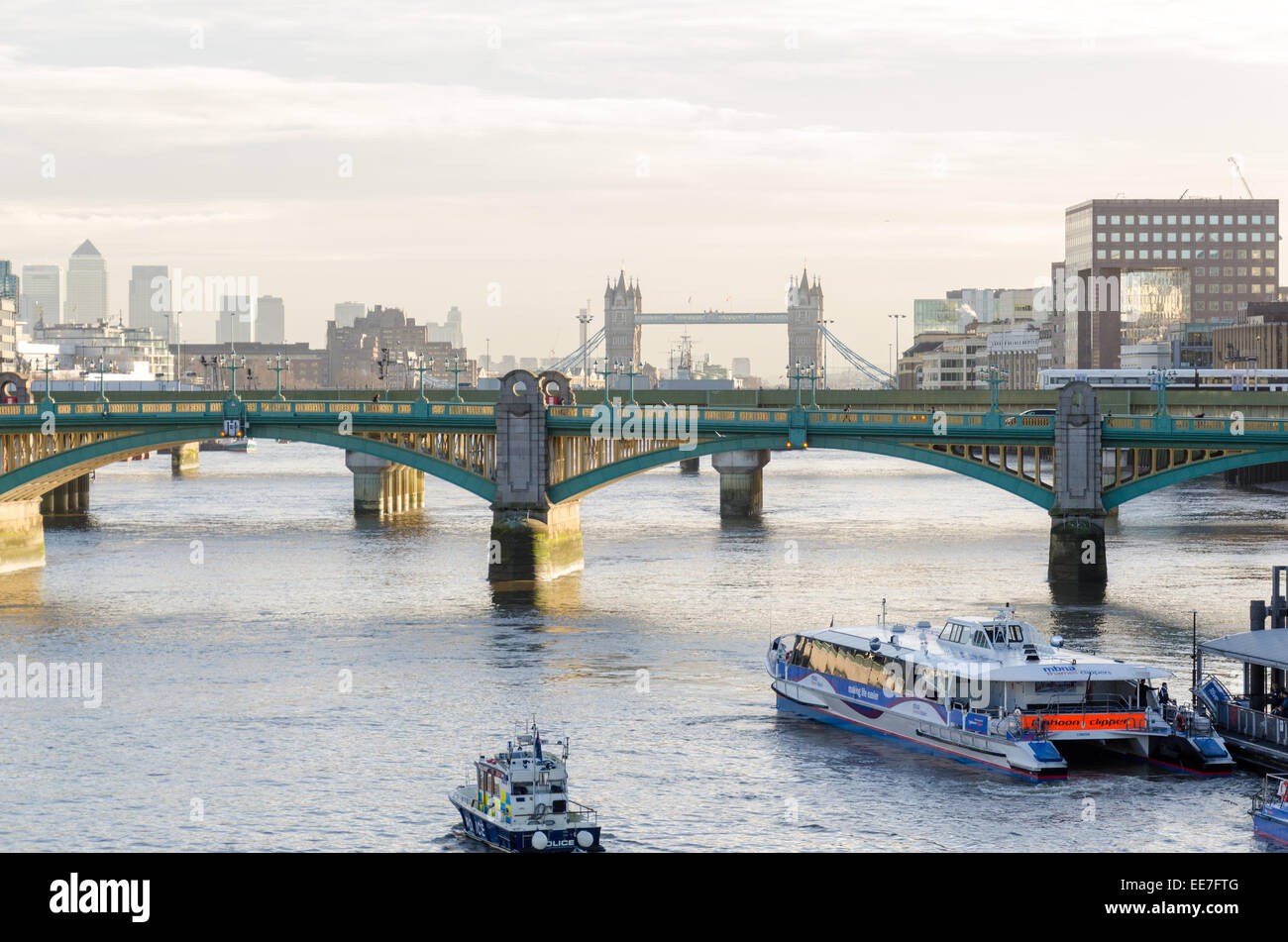 View of Southwark Bridge with a ferry at Bankside Pier to the right ...