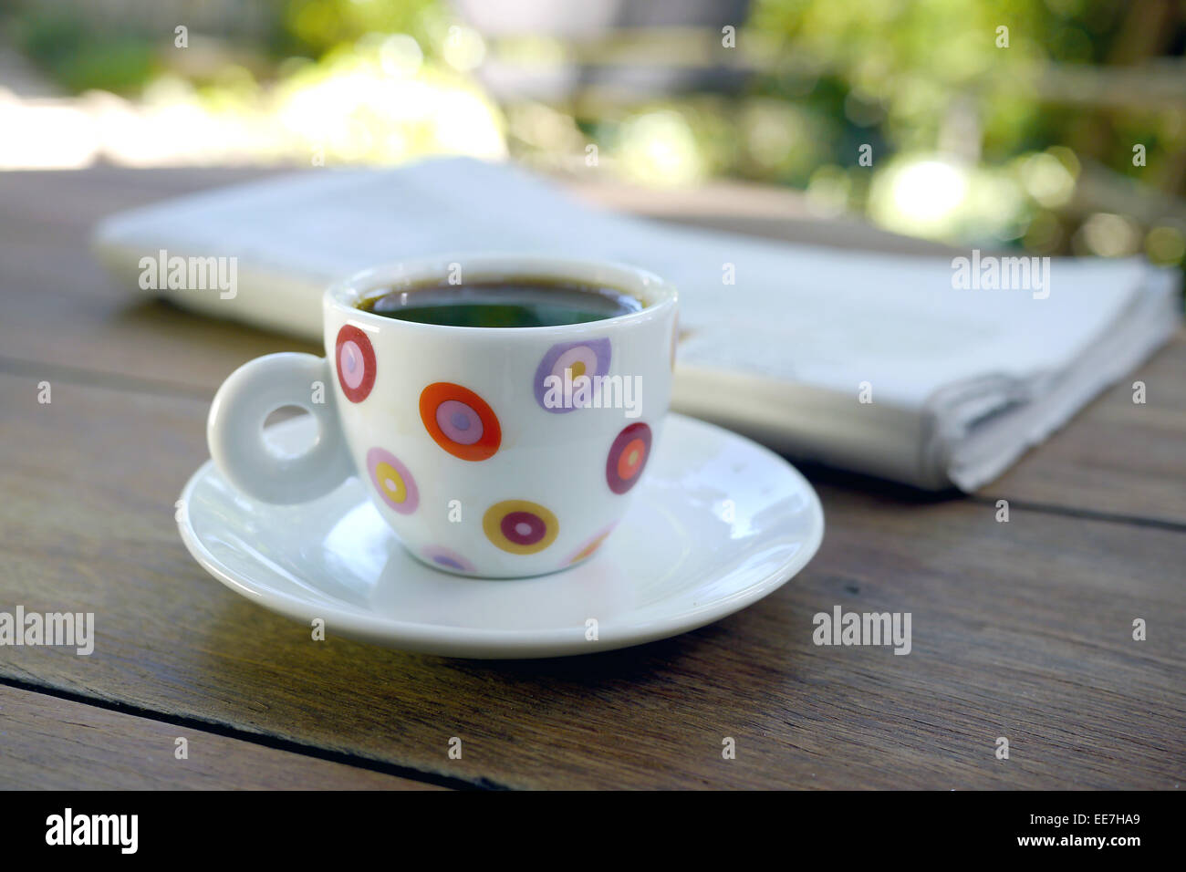 coffee and paper on a cafe table Stock Photo - Alamy