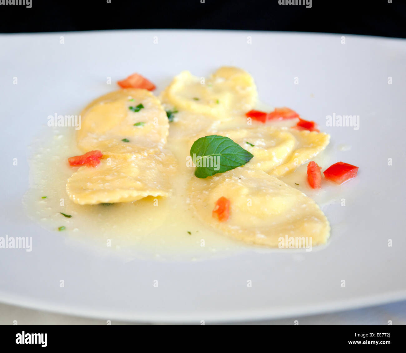 Ravioli pasta with red tomato and basil Stock Photo - Alamy