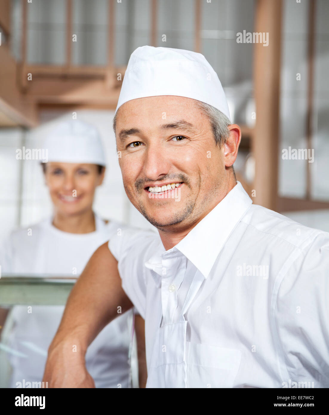 Confident Male Mature Butcher Smiling At Butchery Stock Photo - Alamy