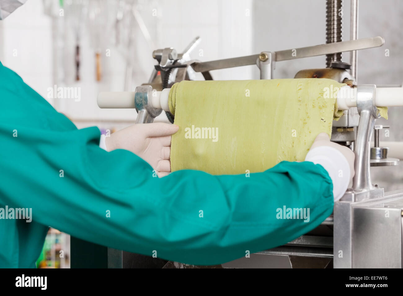 Chef Processing Green Pasta Sheet In Machine Stock Photo - Alamy