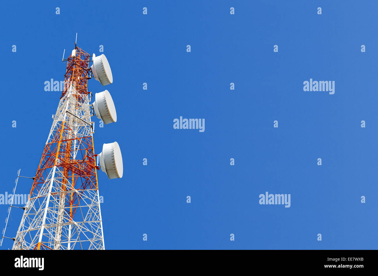 Telecommunication tower on blue sky blank background. Used to transmit ...