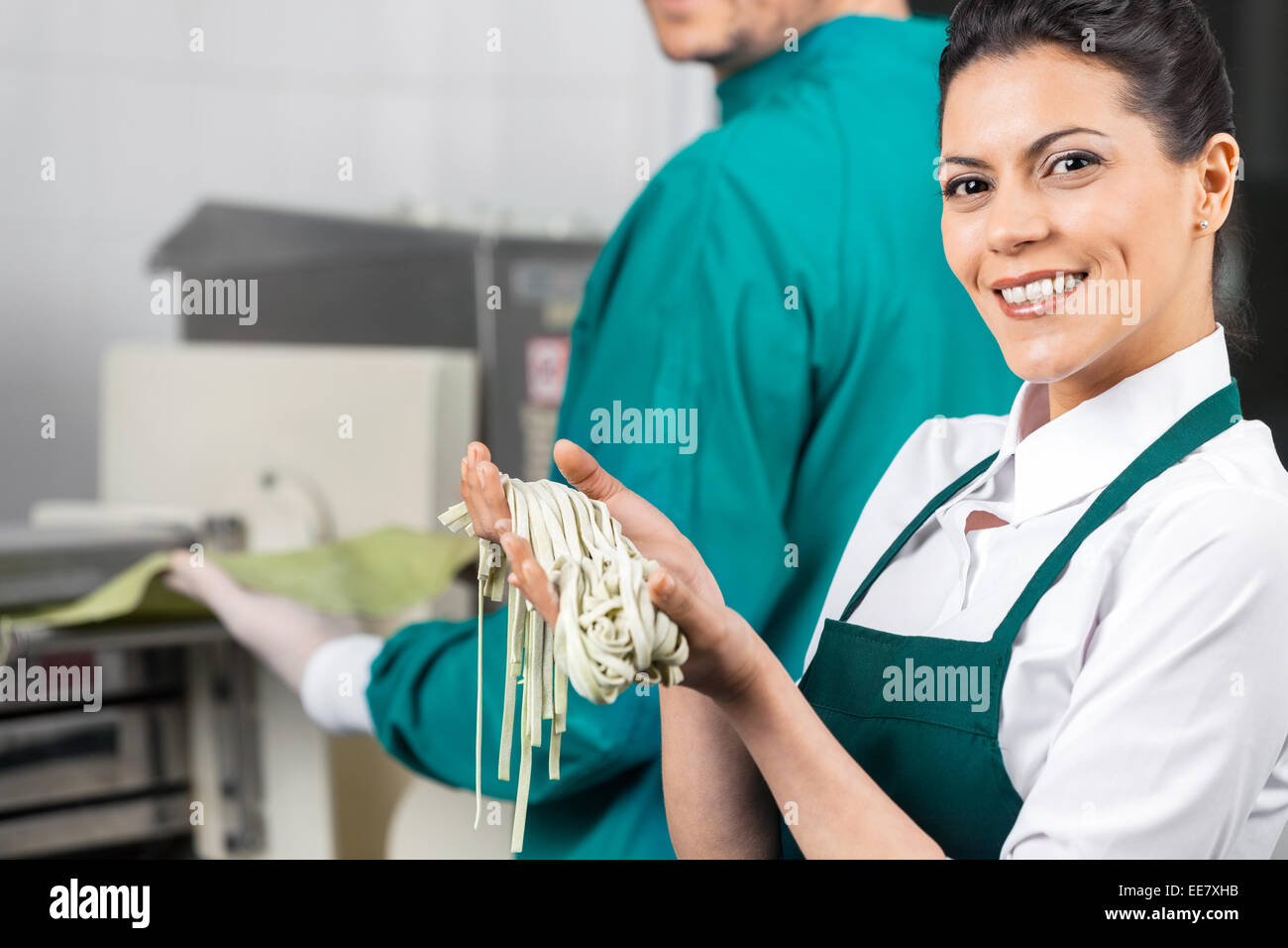 Beautiful Chef Holding Spaghetti Pasta At Kitchen Stock Photo - Alamy