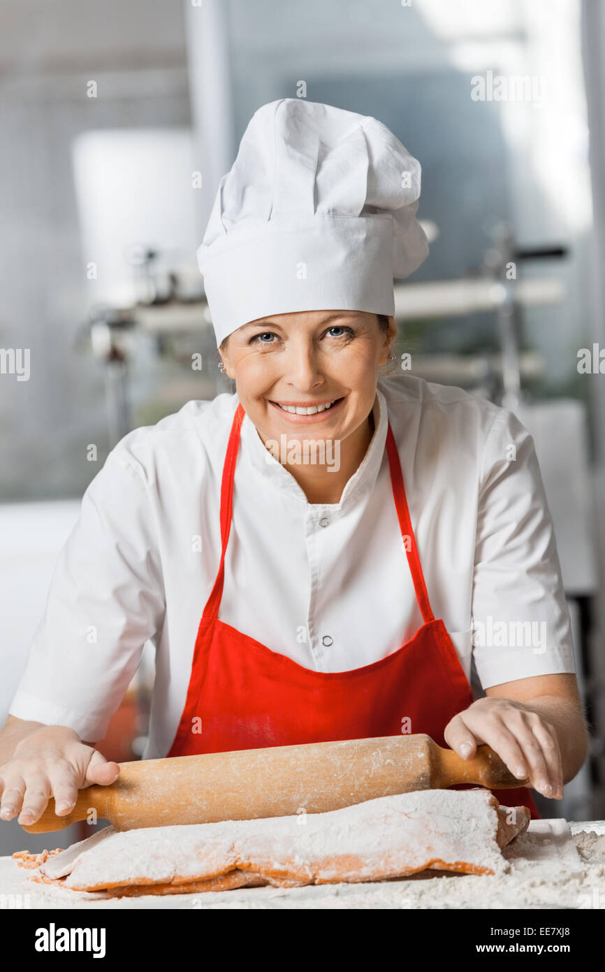Happy Chef Rolling Pasta Sheet At Counter Stock Photo - Alamy
