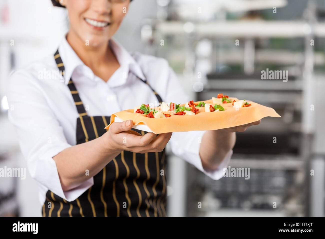 Smiling Chef Holding Tray With Stuffed Ravioli Pasta Sheet Stock Photo ...