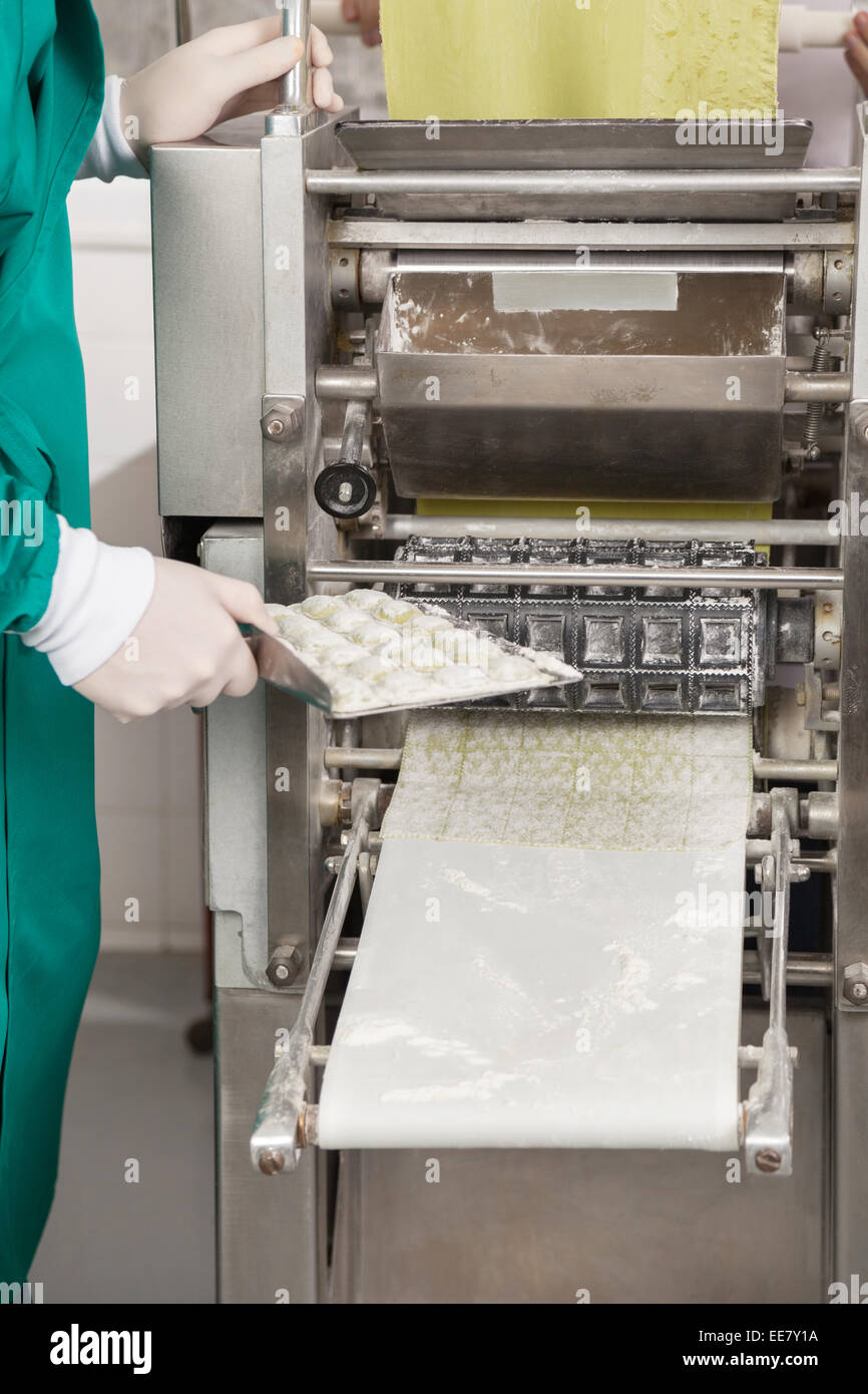 Chef Preparing Ravioli Pasta In Automated Machine Stock Photo - Alamy