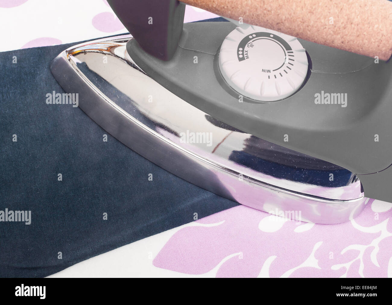 Close up of an iron running with steam Stock Photo - Alamy