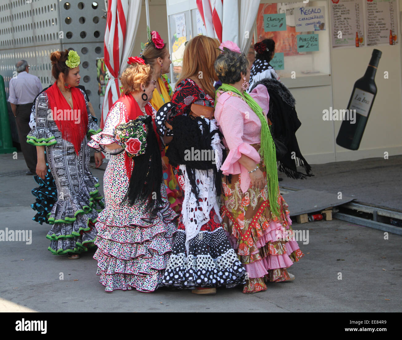 Women in traditional Spanish flamenco dress at the Feria de Abril de ...