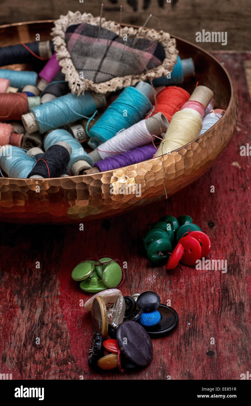 spool sewing thread and buttons in vintage style Stock Photo - Alamy