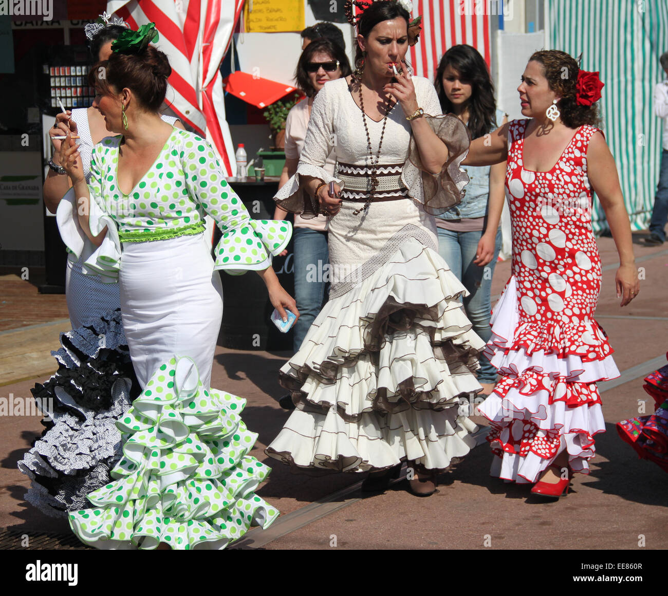 Women In Traditional Spanish Flamenco Dress At The Feria De Abril De