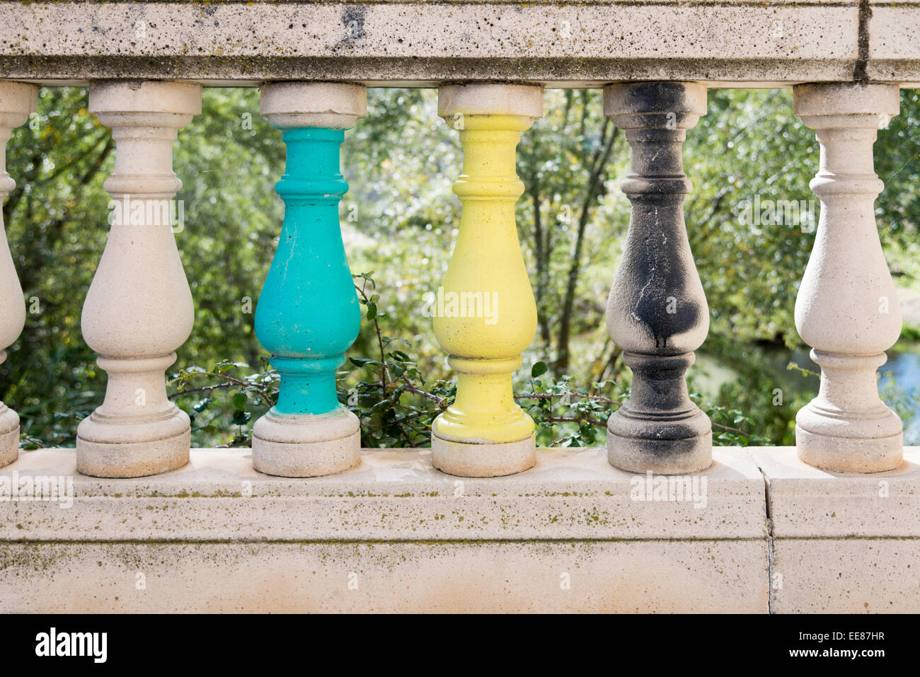 Columns on a stone bridge that have been painted by a graffiti artist ...