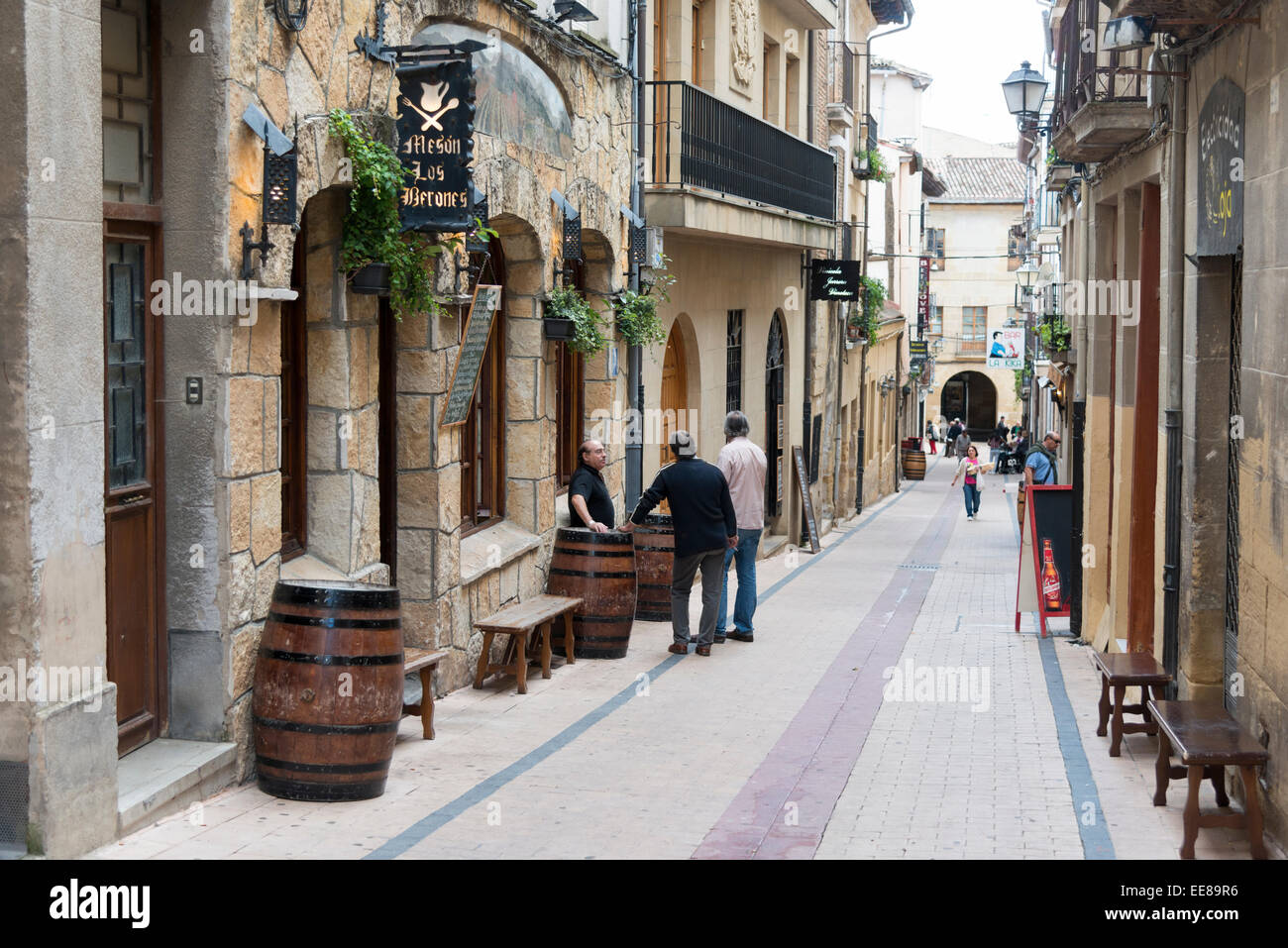 Men drinking outside a bar in a street in Haro town Spain, the capital ...