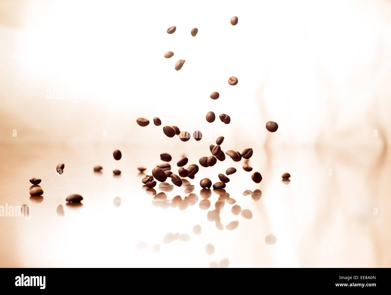 Flying coffee beans on abstract background Stock Photo - Alamy