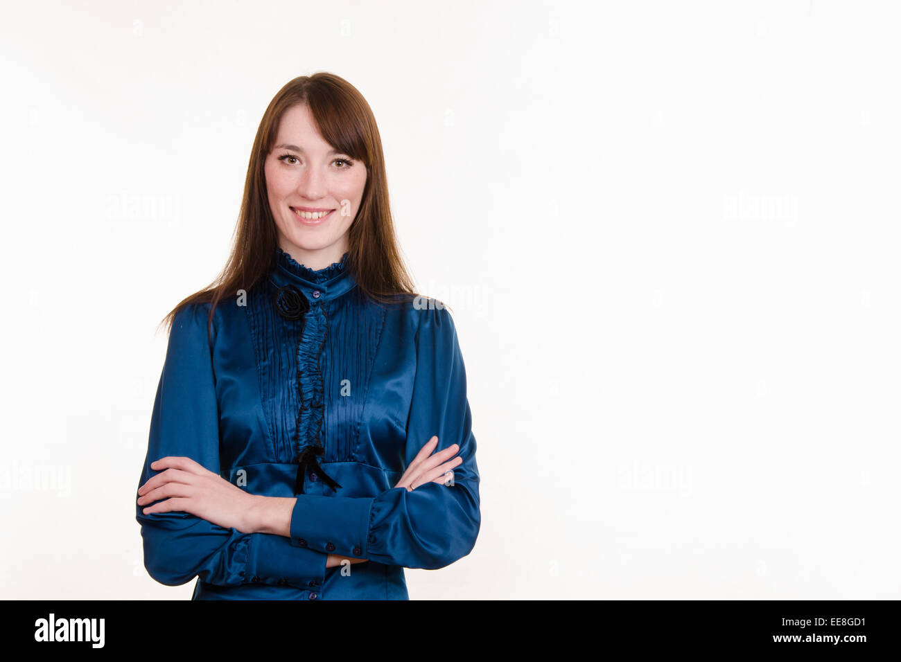 Portrait Of A Young Beautiful Girl In Blue Blouse On A White Background