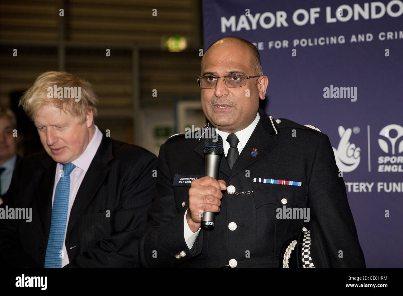 Met Commander Mak Chishty makes a speech next to Boris Johnson at the ...