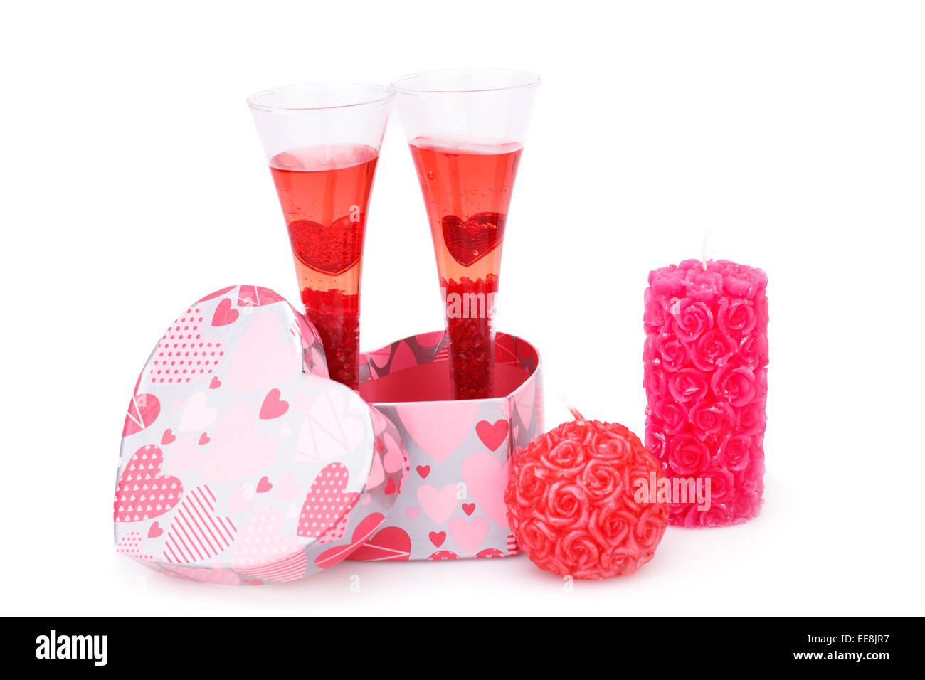 Two glasses, candles, gift box isolated on white background Stock Photo ...