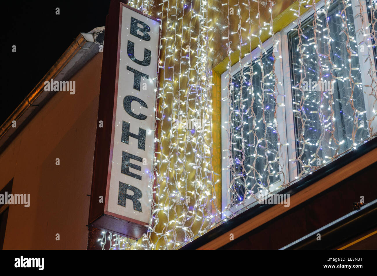 Butcher shop festooned with Christmas lights Stock Photo - Alamy