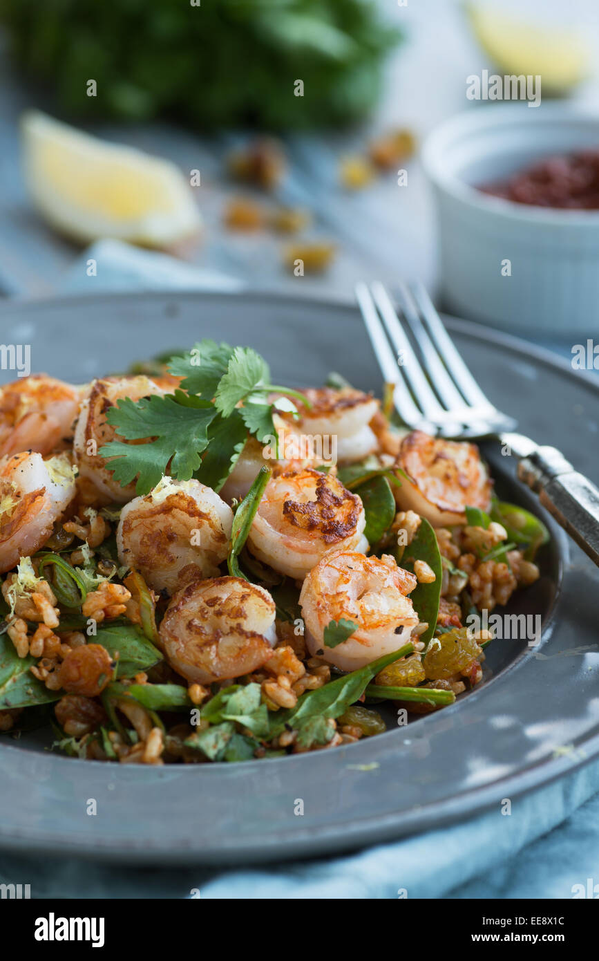 Harissa rice and greens and seared shrimp Stock Photo - Alamy
