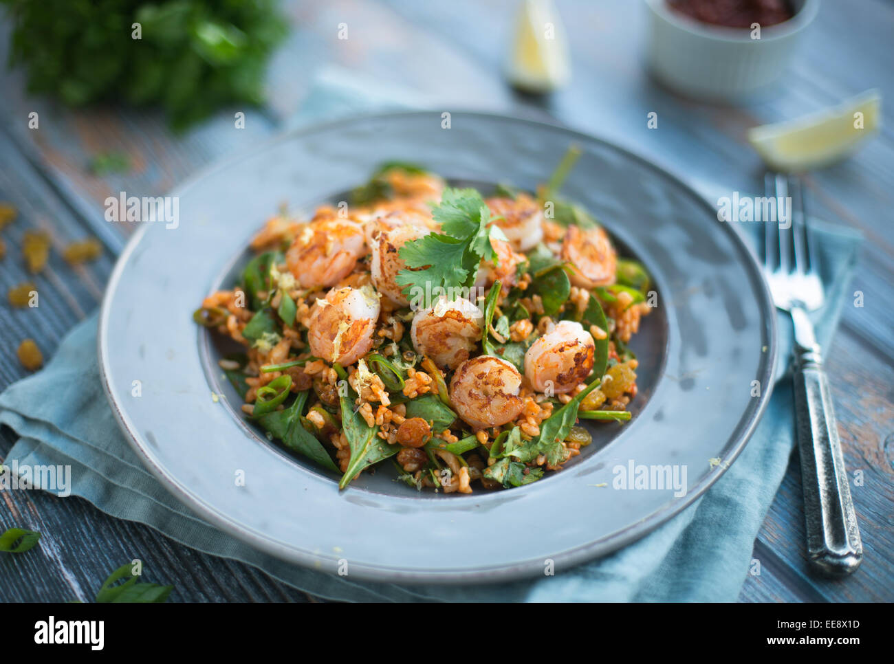 Harissa rice and greens and seared shrimp Stock Photo - Alamy