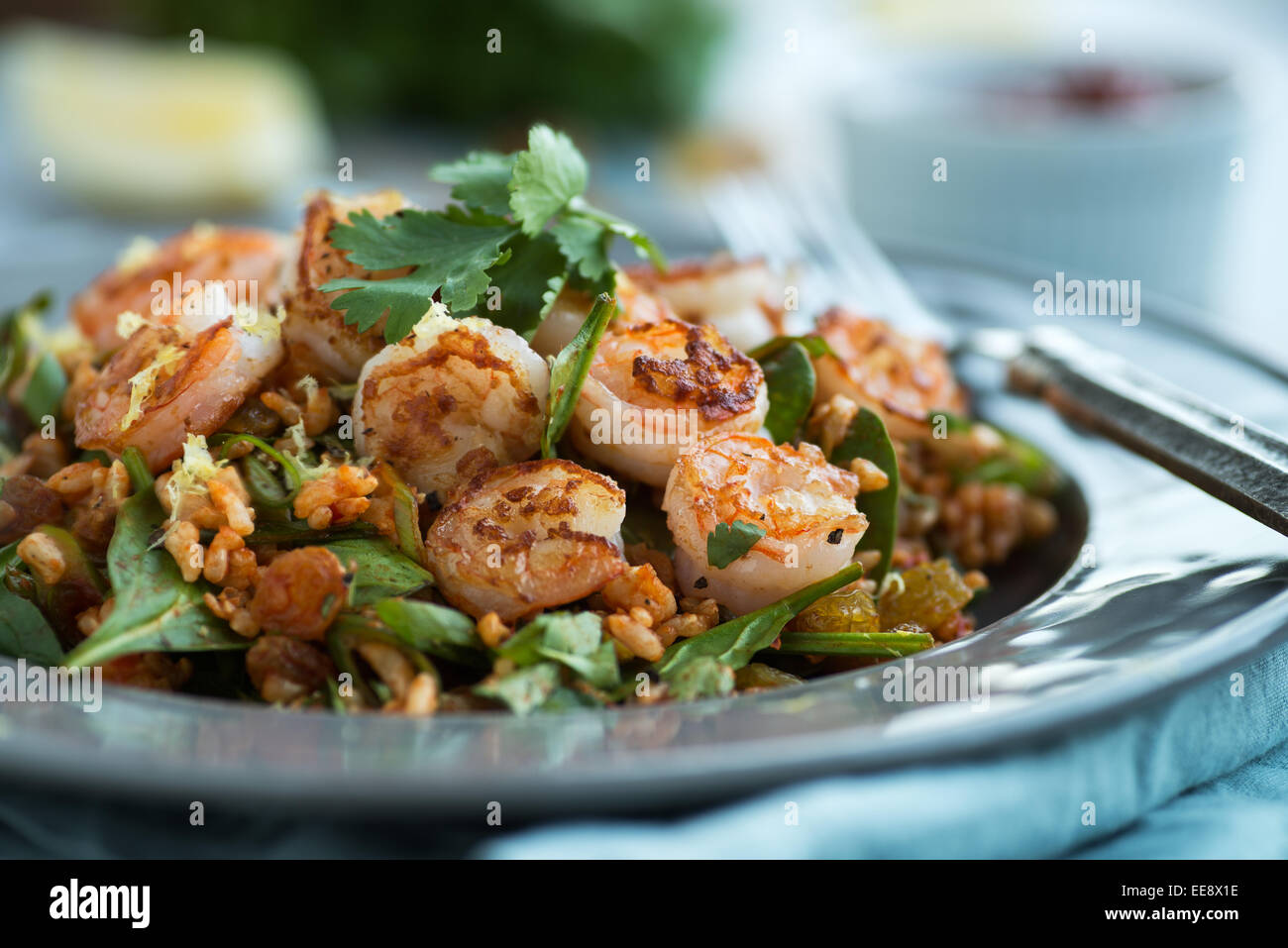 Harissa rice and greens and seared shrimp Stock Photo - Alamy