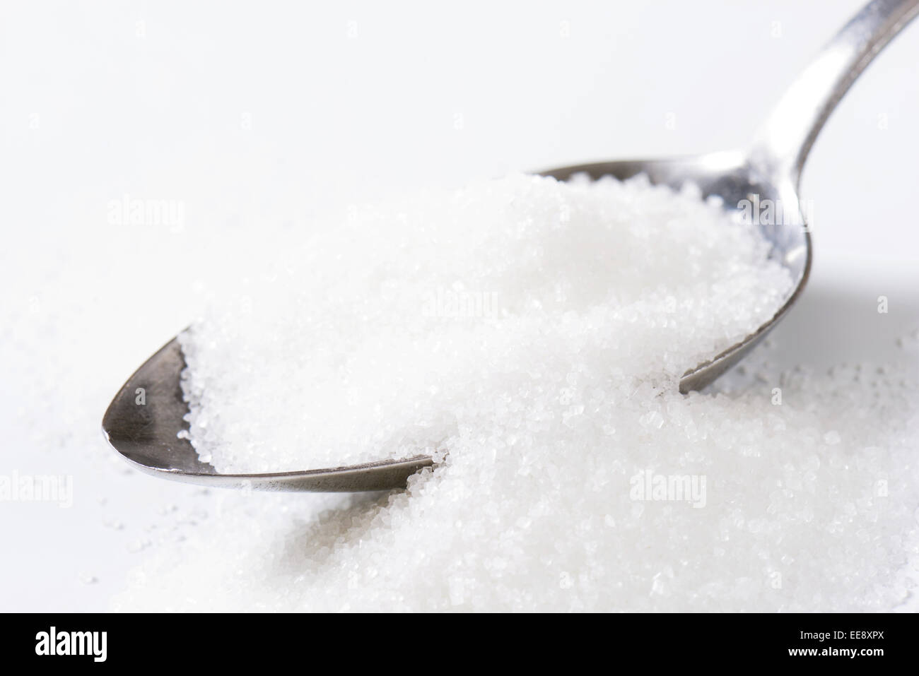 Spoon of fine granulated sugar Stock Photo - Alamy
