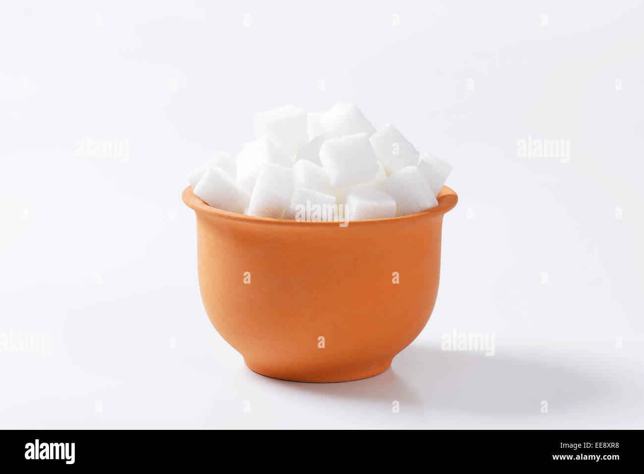 White sugar cubes in terracotta dish Stock Photo - Alamy