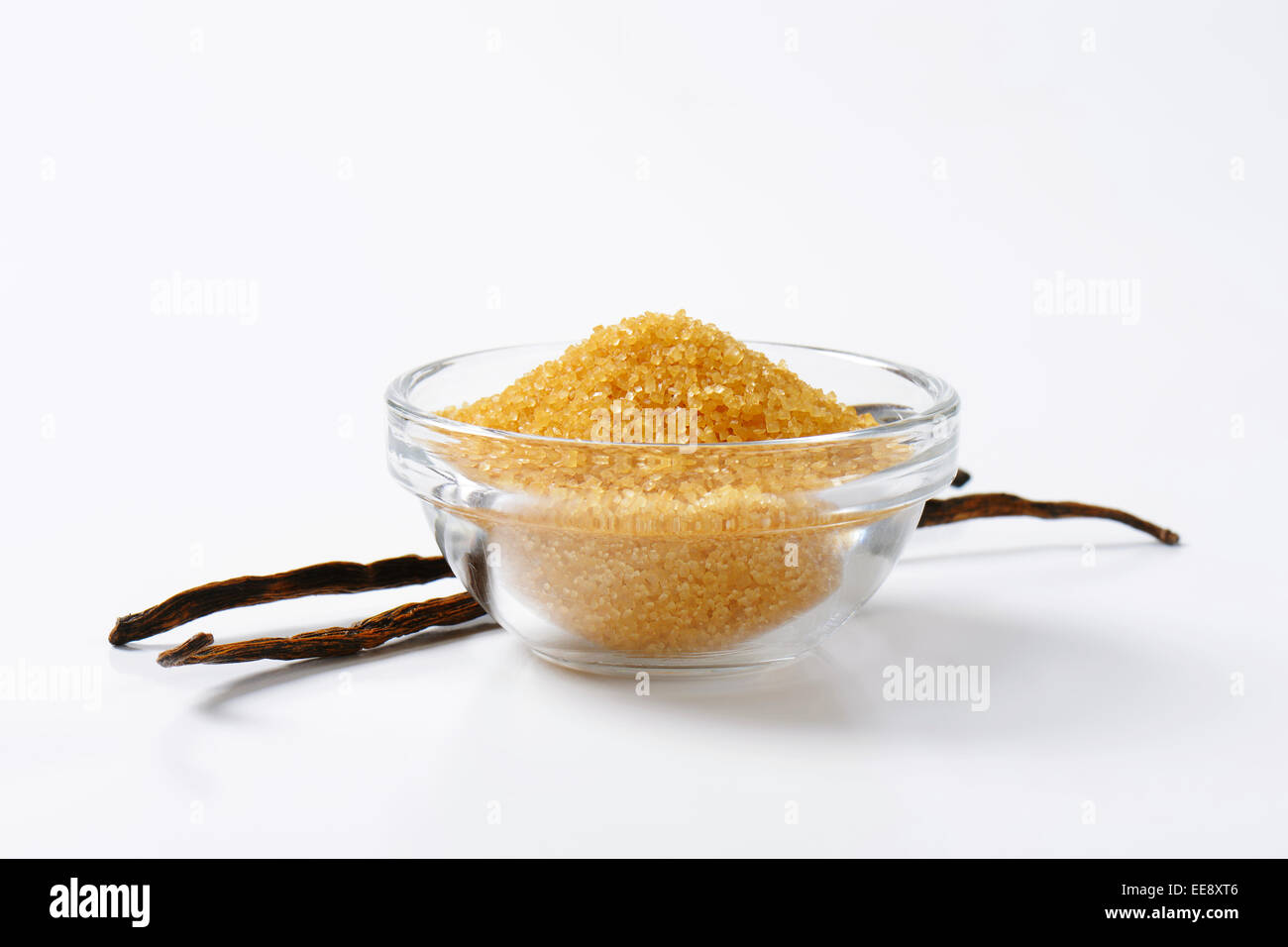 Bowl of golden brown raw cane sugar and two vanilla pods Stock Photo ...