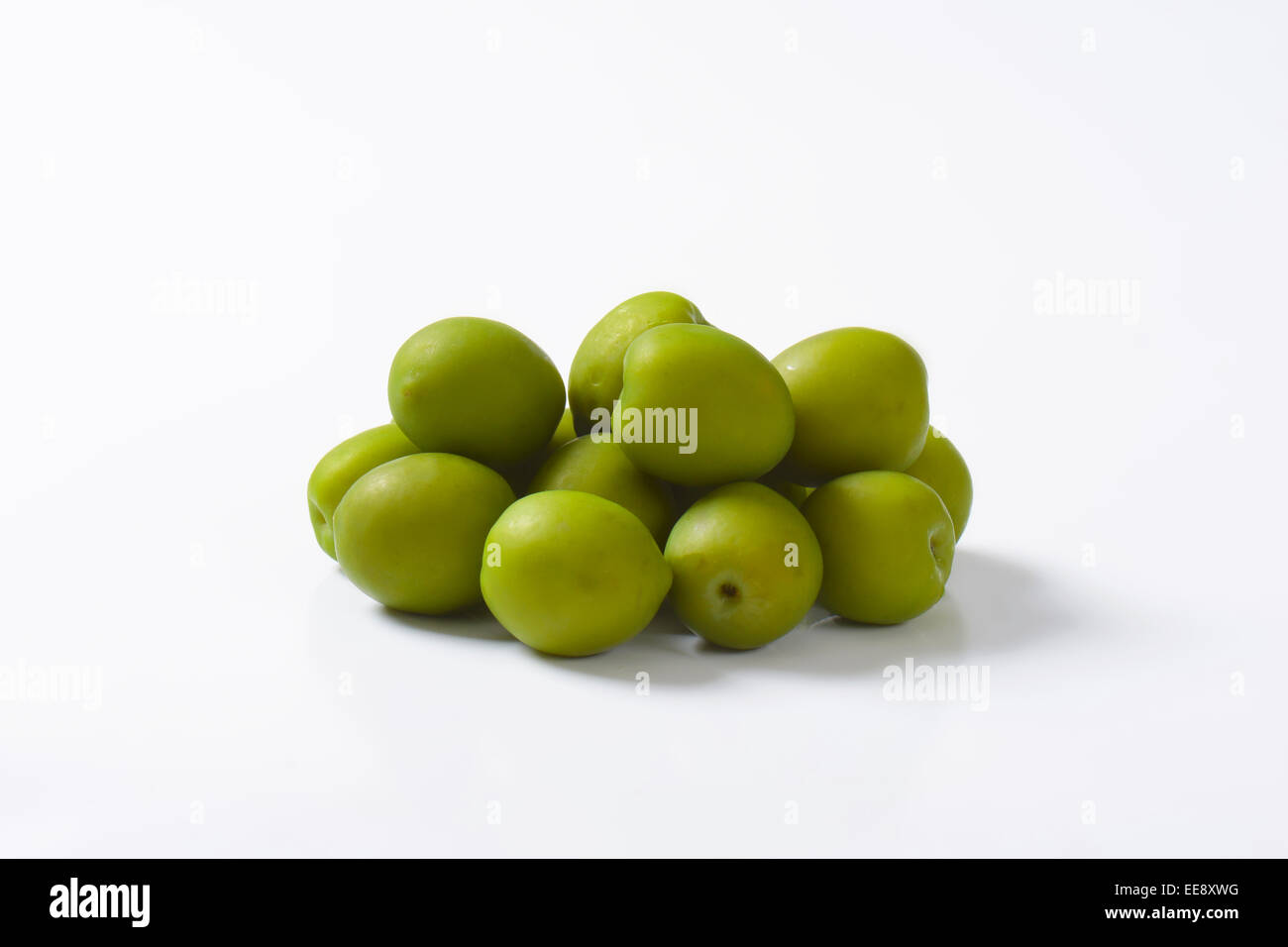 Fresh green olives on white background Stock Photo - Alamy
