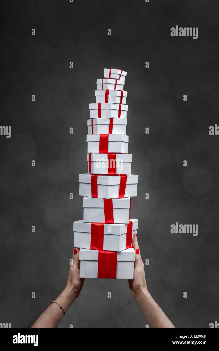 Hands holding present stack hi-res stock photography and images - Alamy