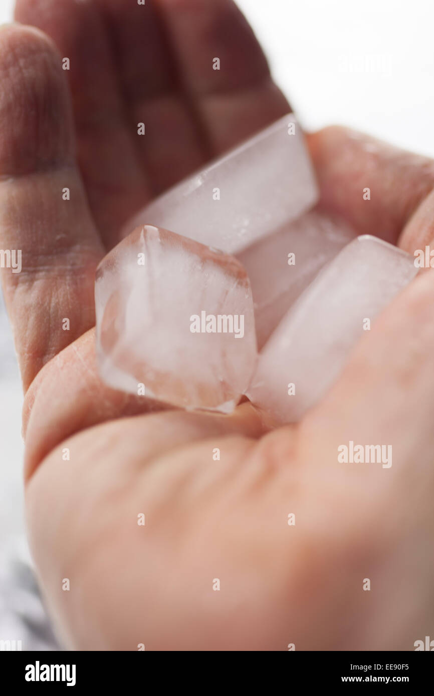 Melting ice cube hand hi-res stock photography and images - Alamy