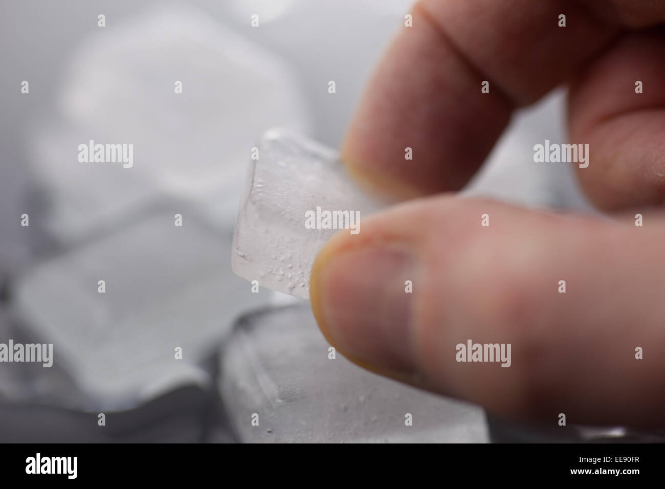Melting ice cube hand hi-res stock photography and images - Alamy