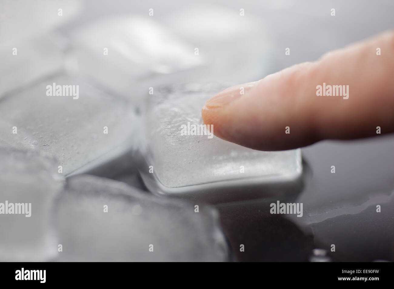 Finger touching ice hi-res stock photography and images - Alamy