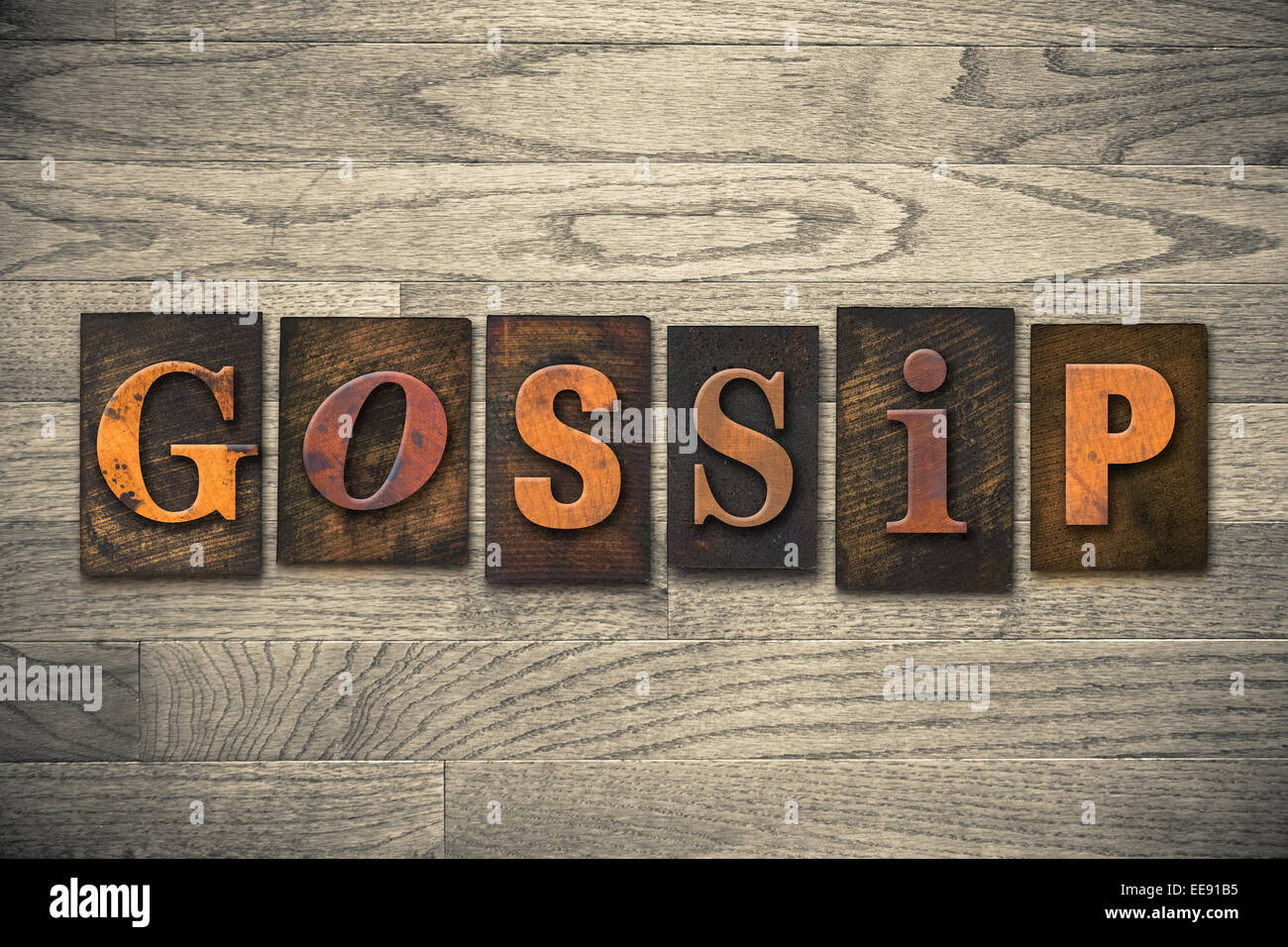The word "GOSSIP" written in wooden letterpress type Stock Photo - Alamy