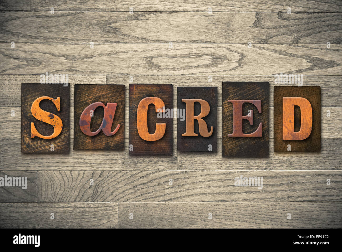 The word "SACRED" written in wooden letterpress type Stock Photo - Alamy