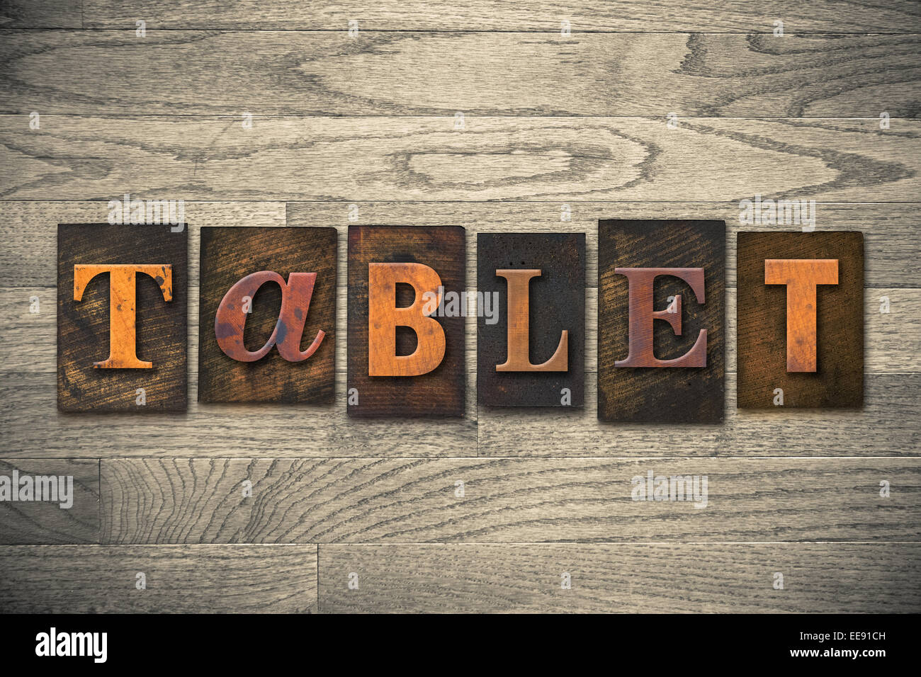 The word "TABLET" written in wooden letterpress type Stock Photo - Alamy