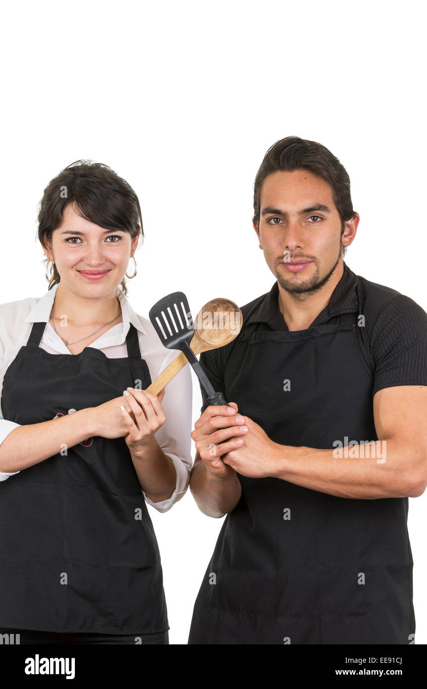 young attractive couple chefs wearing black apron Stock Photo - Alamy