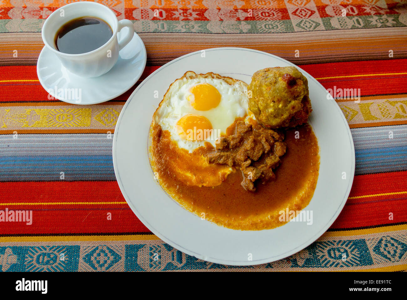 Bolon de verde with fried egg and meat stew ecuadorian food Stock Photo ...