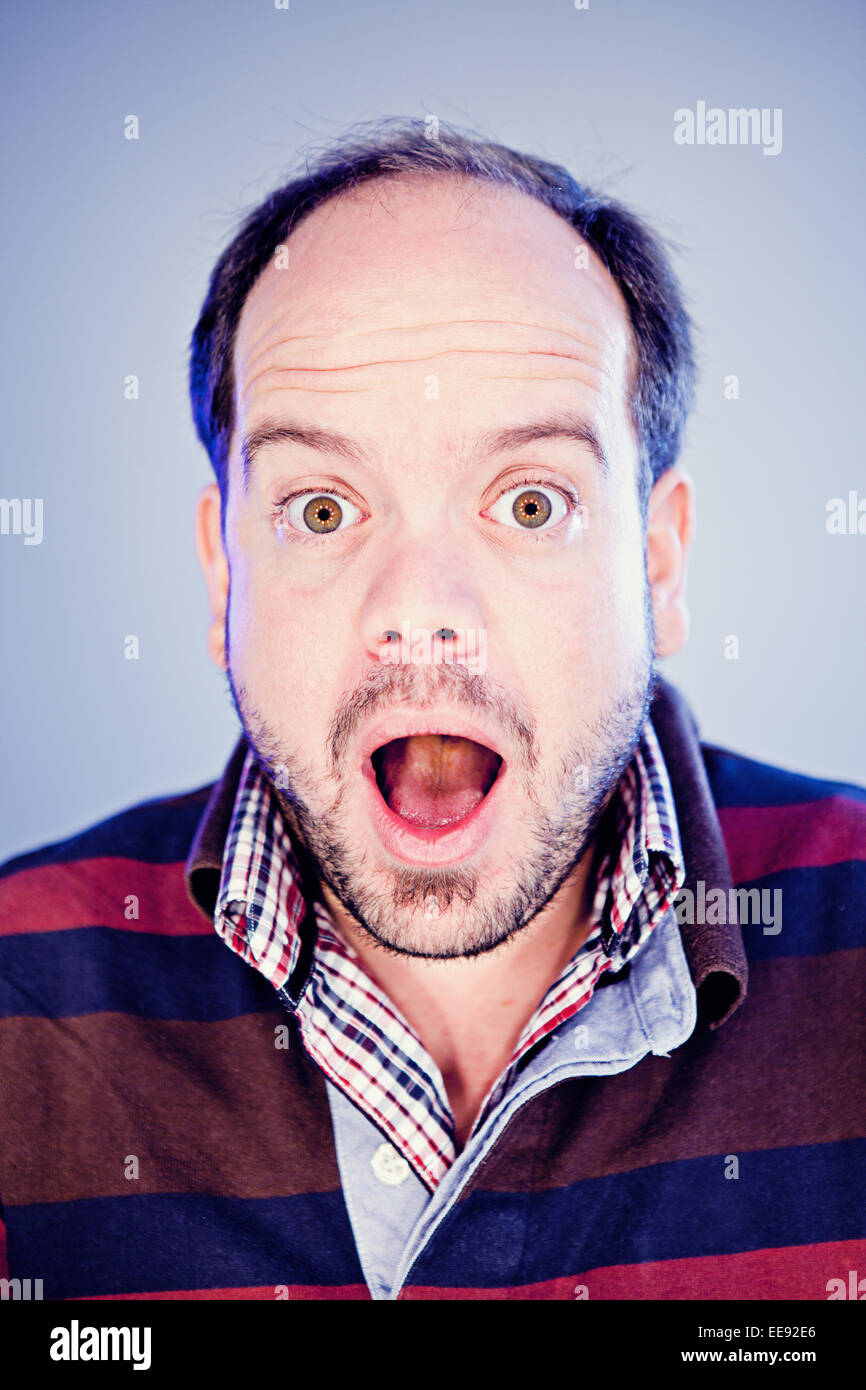 A look of shock on this young mans face Stock Photo - Alamy