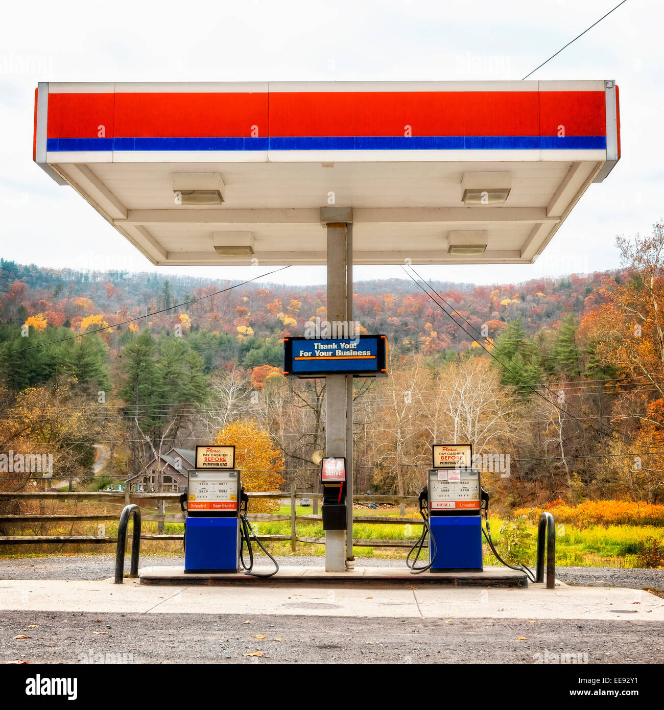 Gas pumps with beautiful fall foliage in background Stock Photo - Alamy