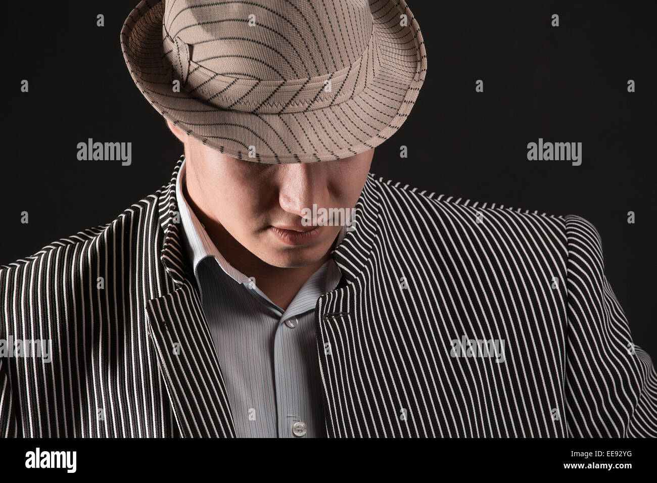 The man in style Chicago gangster on dark background Stock Photo - Alamy